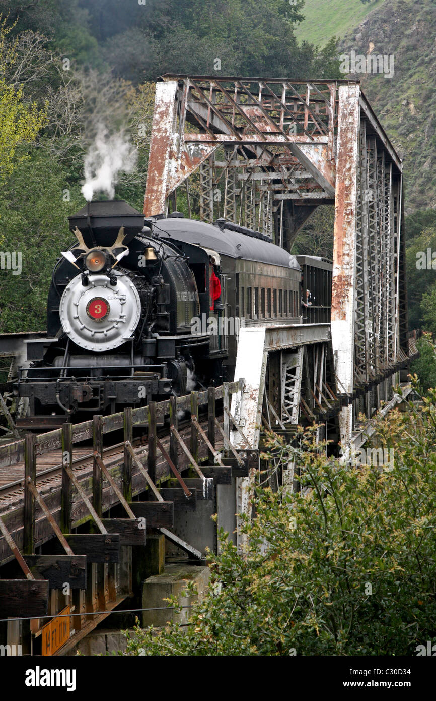 The Robert Dollar Co. steam engine #3 pulls a passenger train over a ...