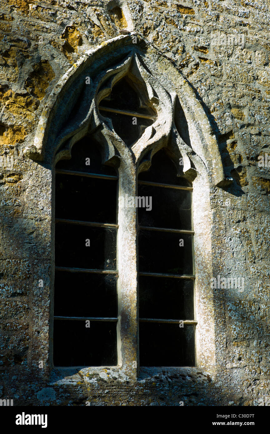 Norman style old stone window at 11th Century St Nicholas Church ...