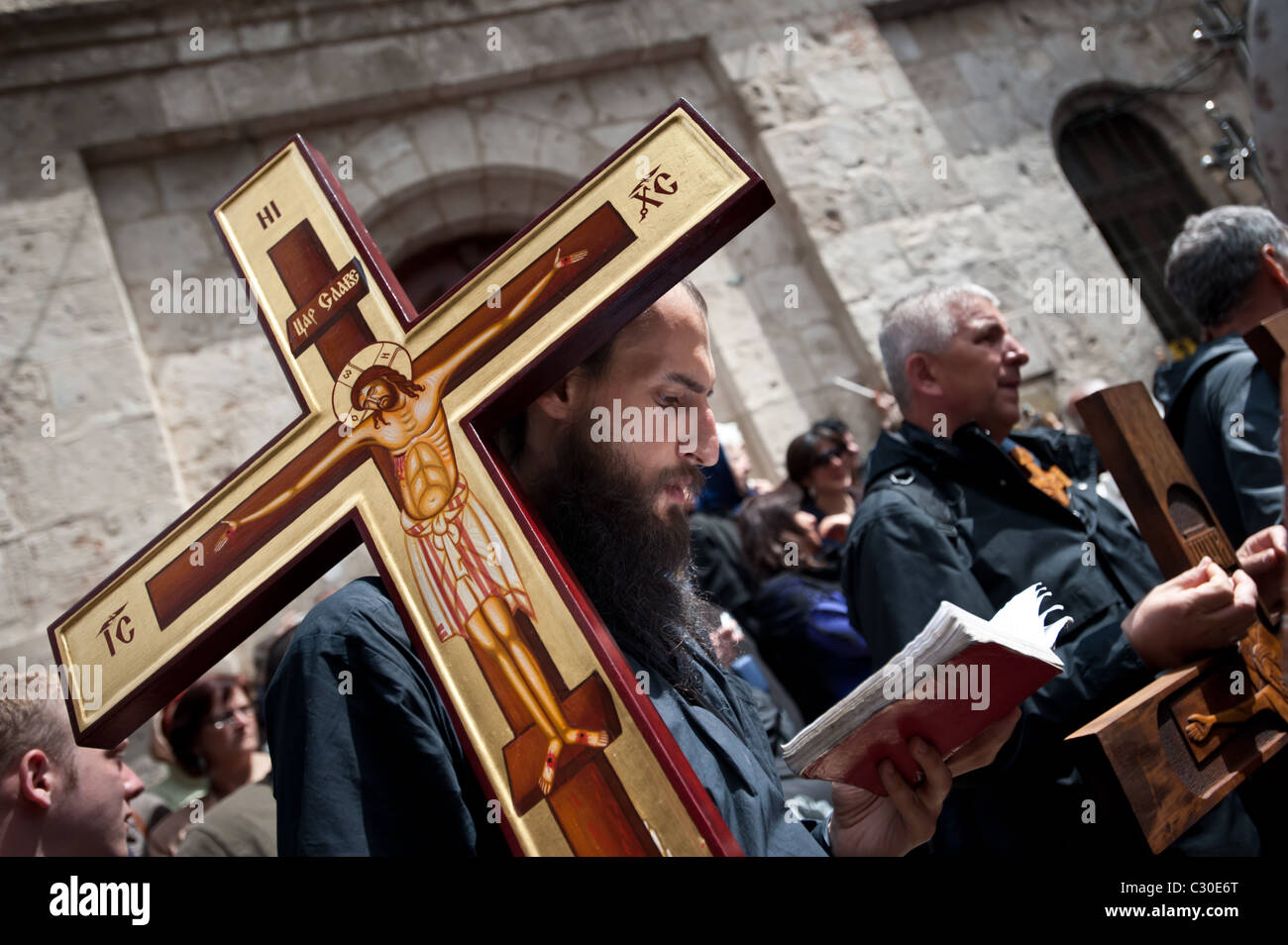 Orthodox Christian pilgrims carry crosses along the Via Dolorosa ...