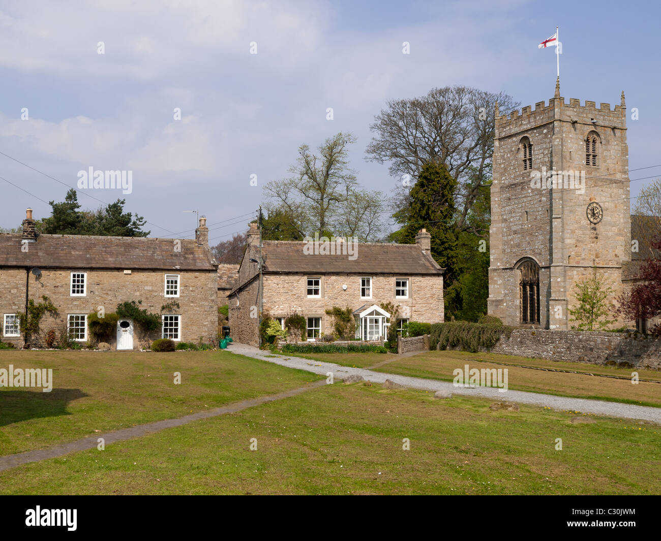 Cottages and the historic church of St Romald in the conservation area ...