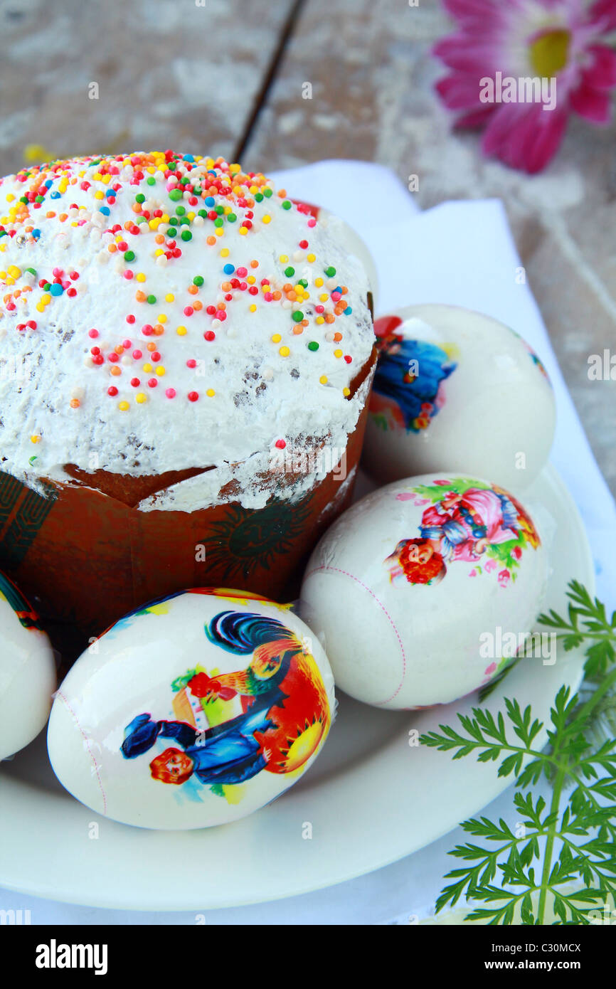Easter cake with glace icing and colored easter eggs Stock Photo - Alamy