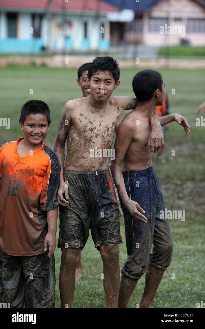 Boys covered in mud after playing soccer in the Cameron Highlands Stock ...