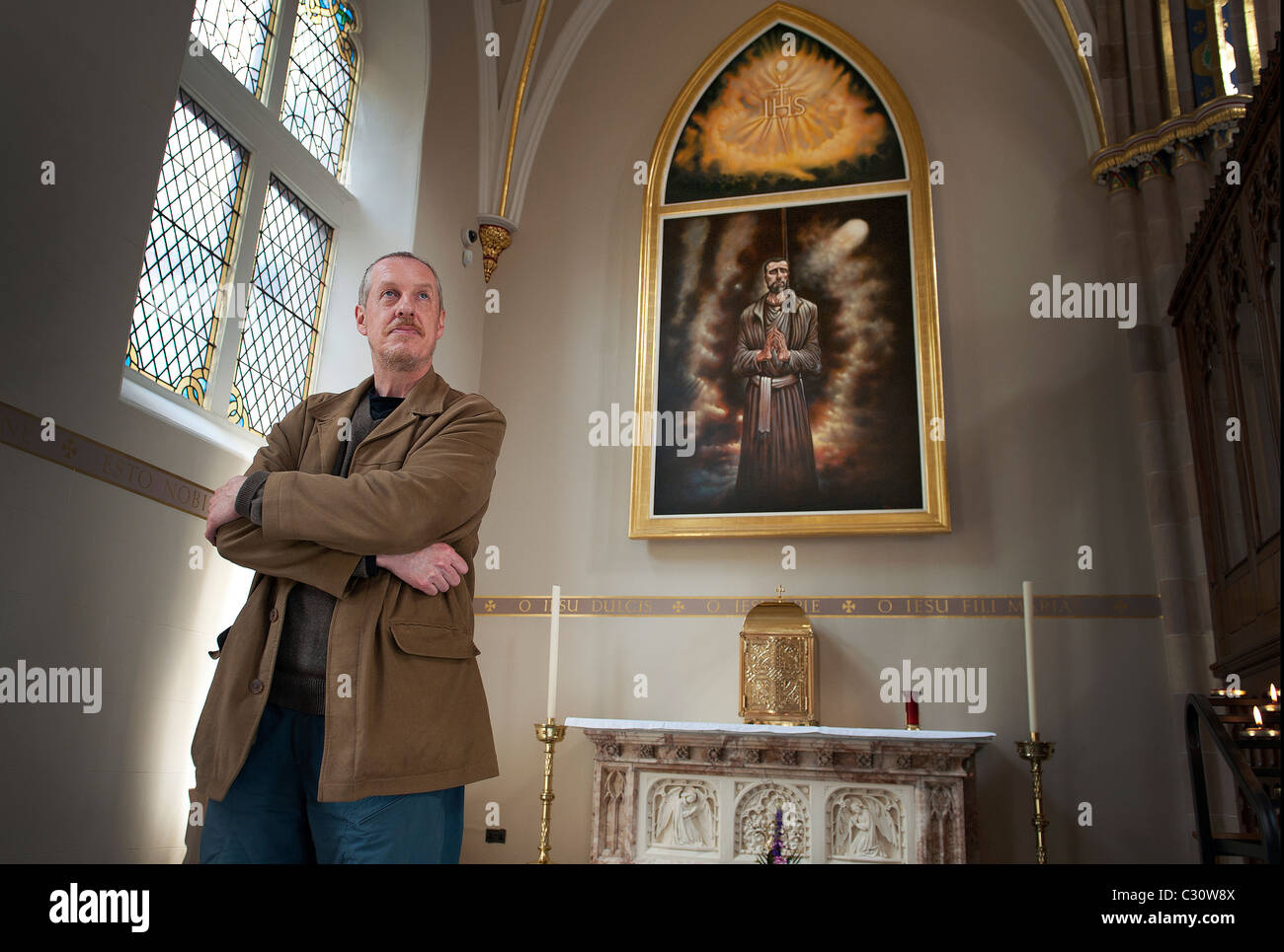 Glasgow artist Peter Howson with his painting of John Ogilvie in St ...