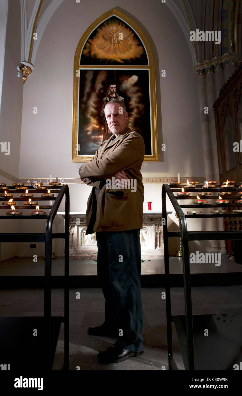 Glasgow artist Peter Howson with his painting of John Ogilvie in St ...