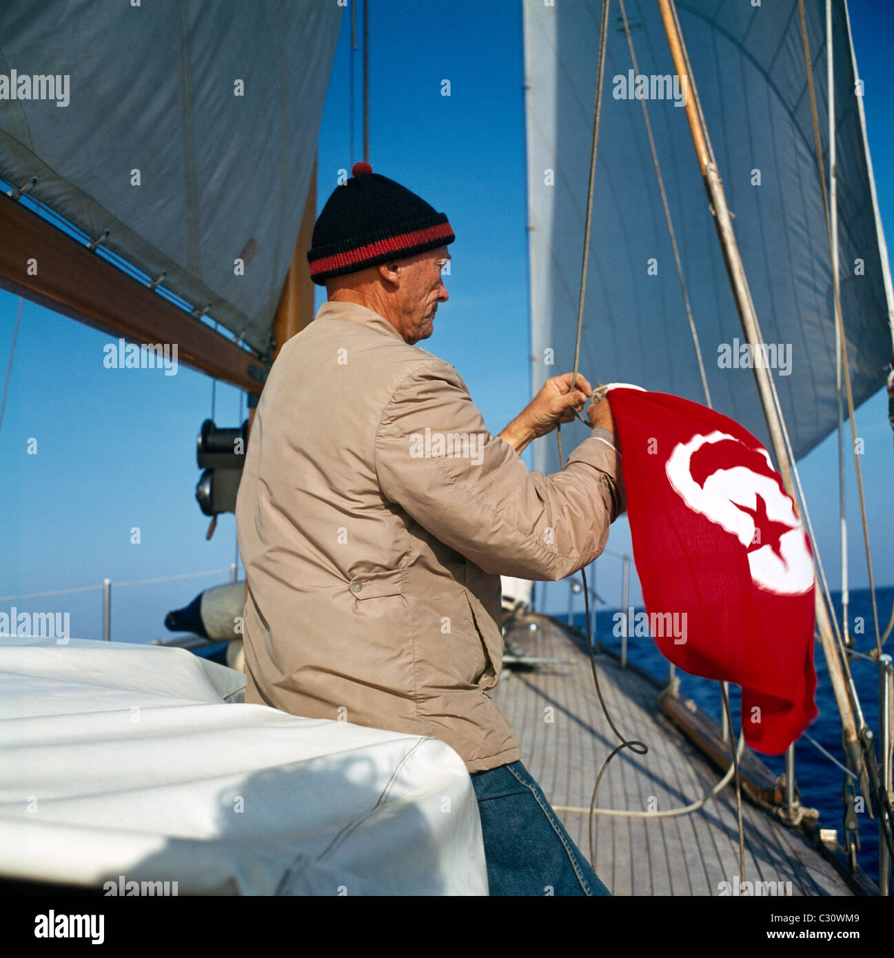 Man On Sailing Boat Asperida preparing to fly turkish flag Stock Photo ...