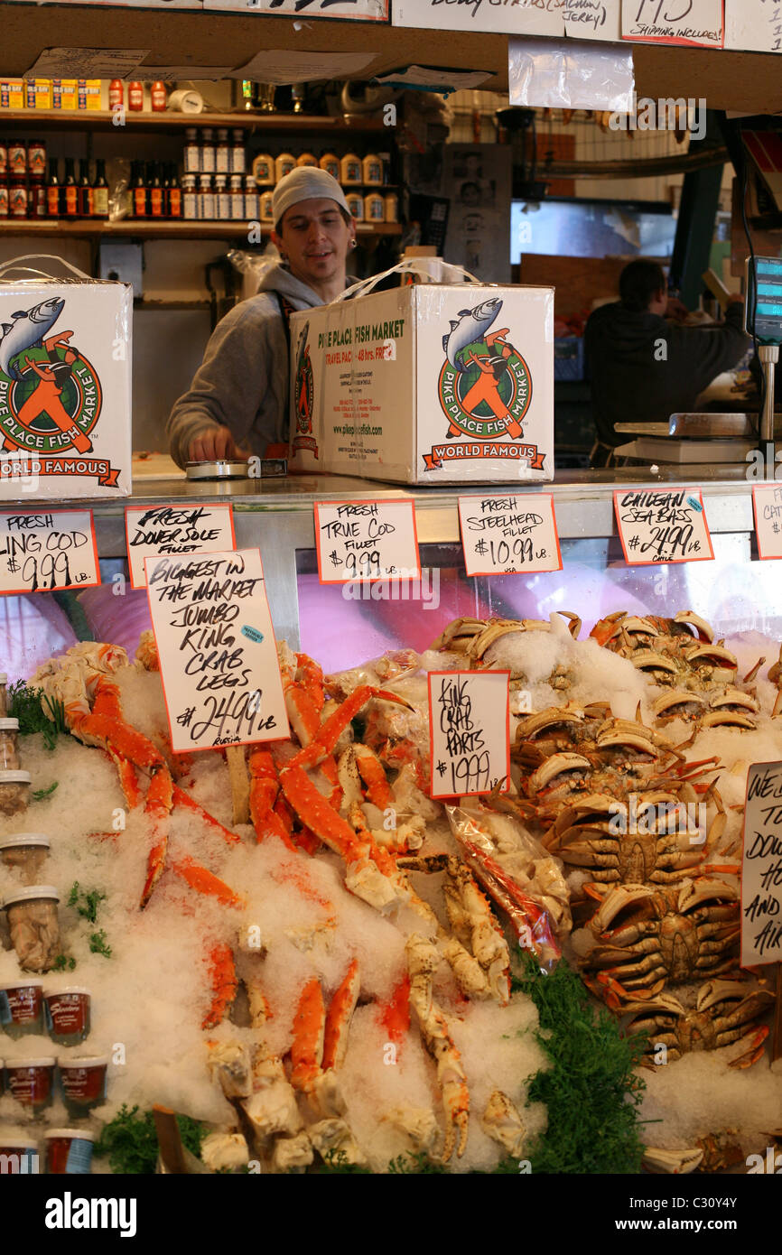 Fishmongers and their fresh produce at popular Farmers Market Stock ...