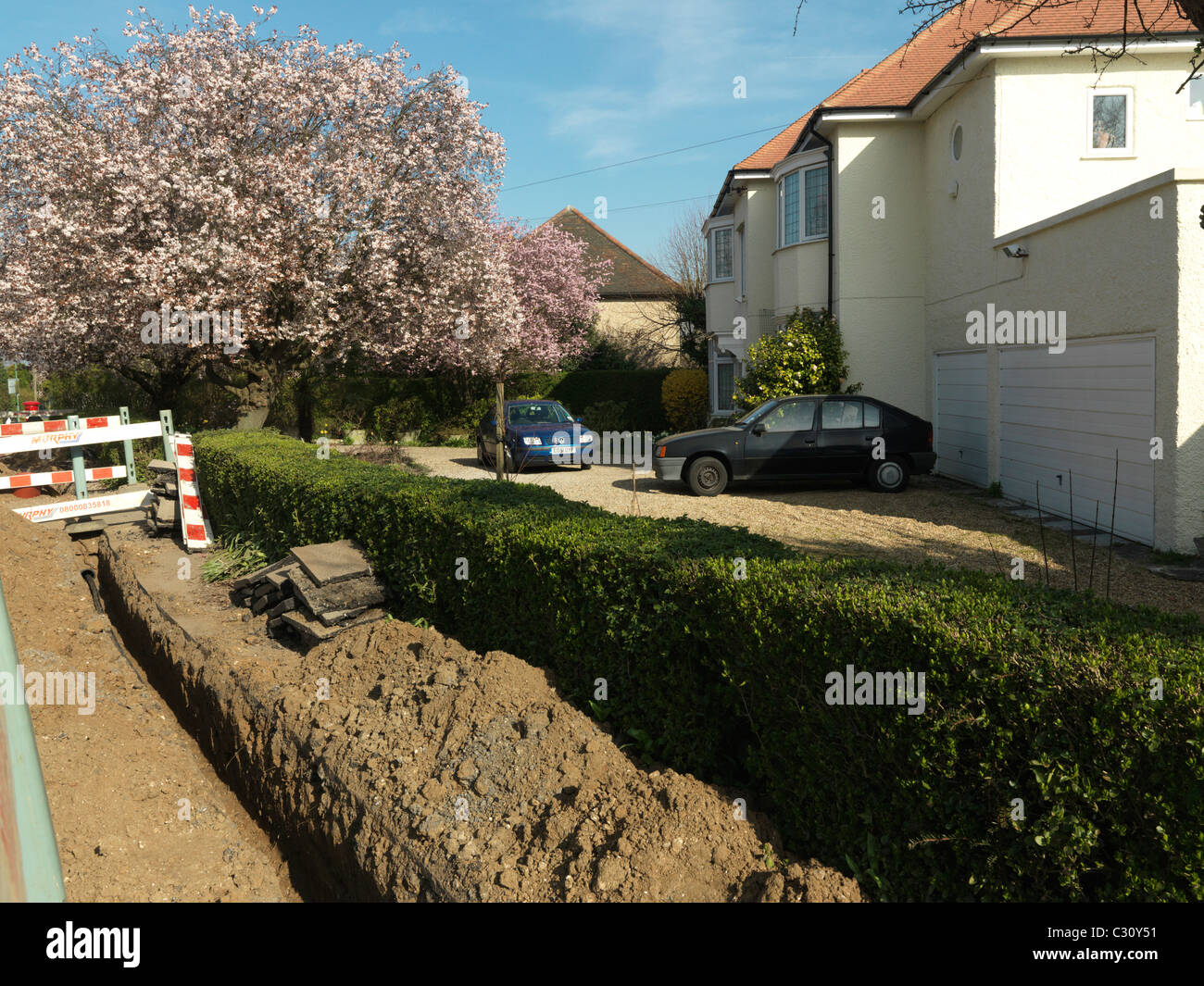 Electricity Cable Being Layed Down Outside House England Stock Photo ...