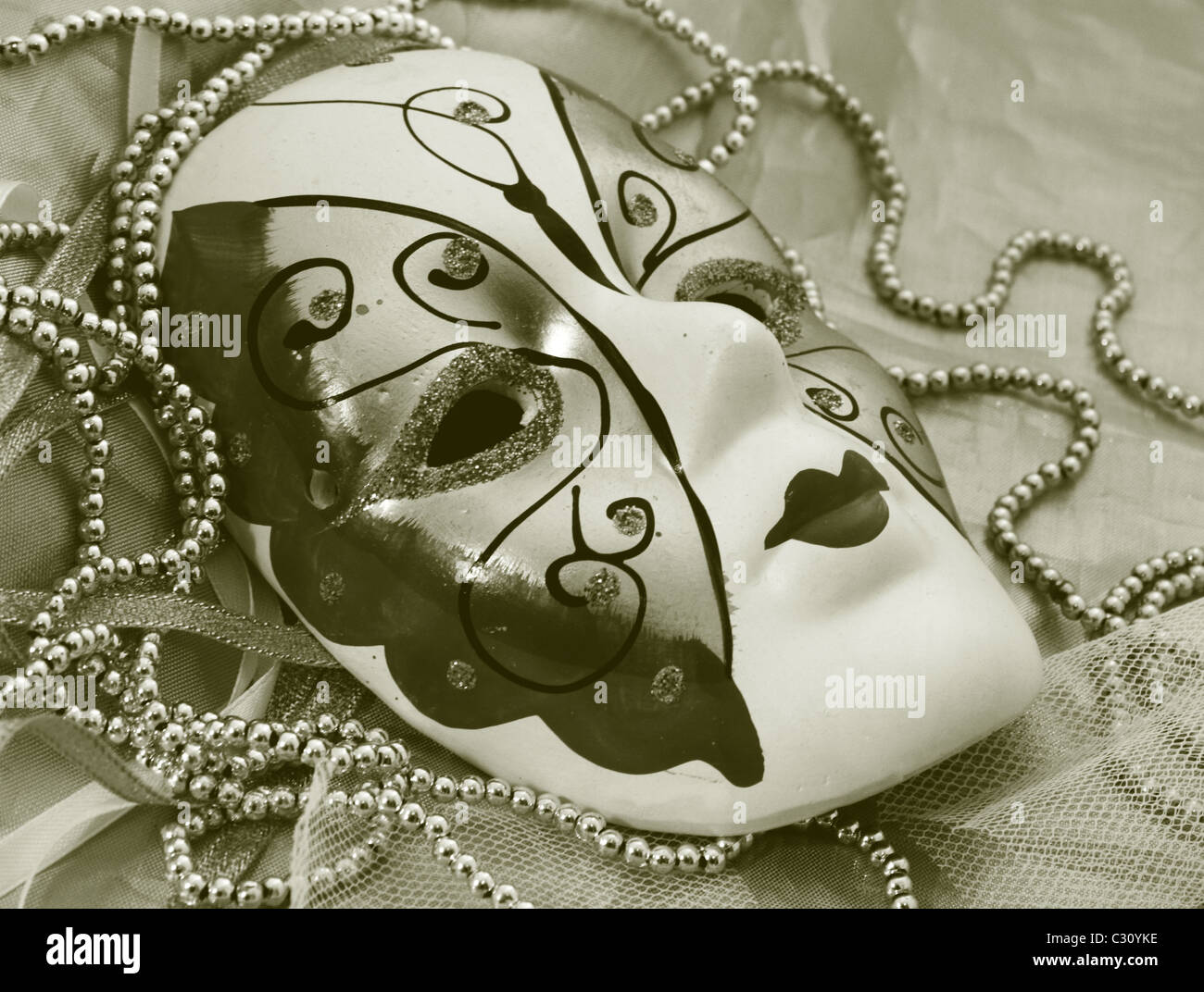theatre mask among beads and tapes Stock Photo - Alamy