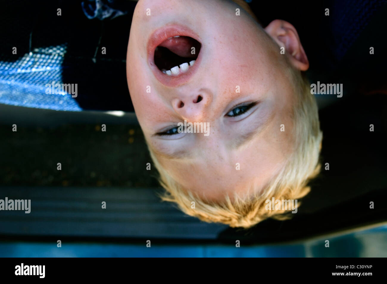 A happy 6 year old boy lets out a loud yell Stock Photo - Alamy