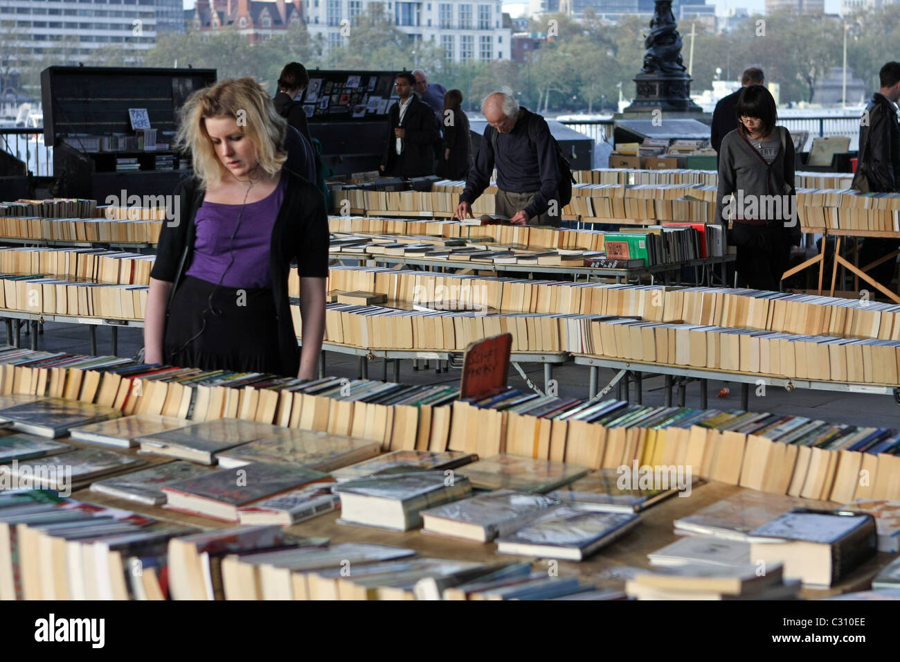 people looking at books in an open air bookstall underneath Waterloo ...