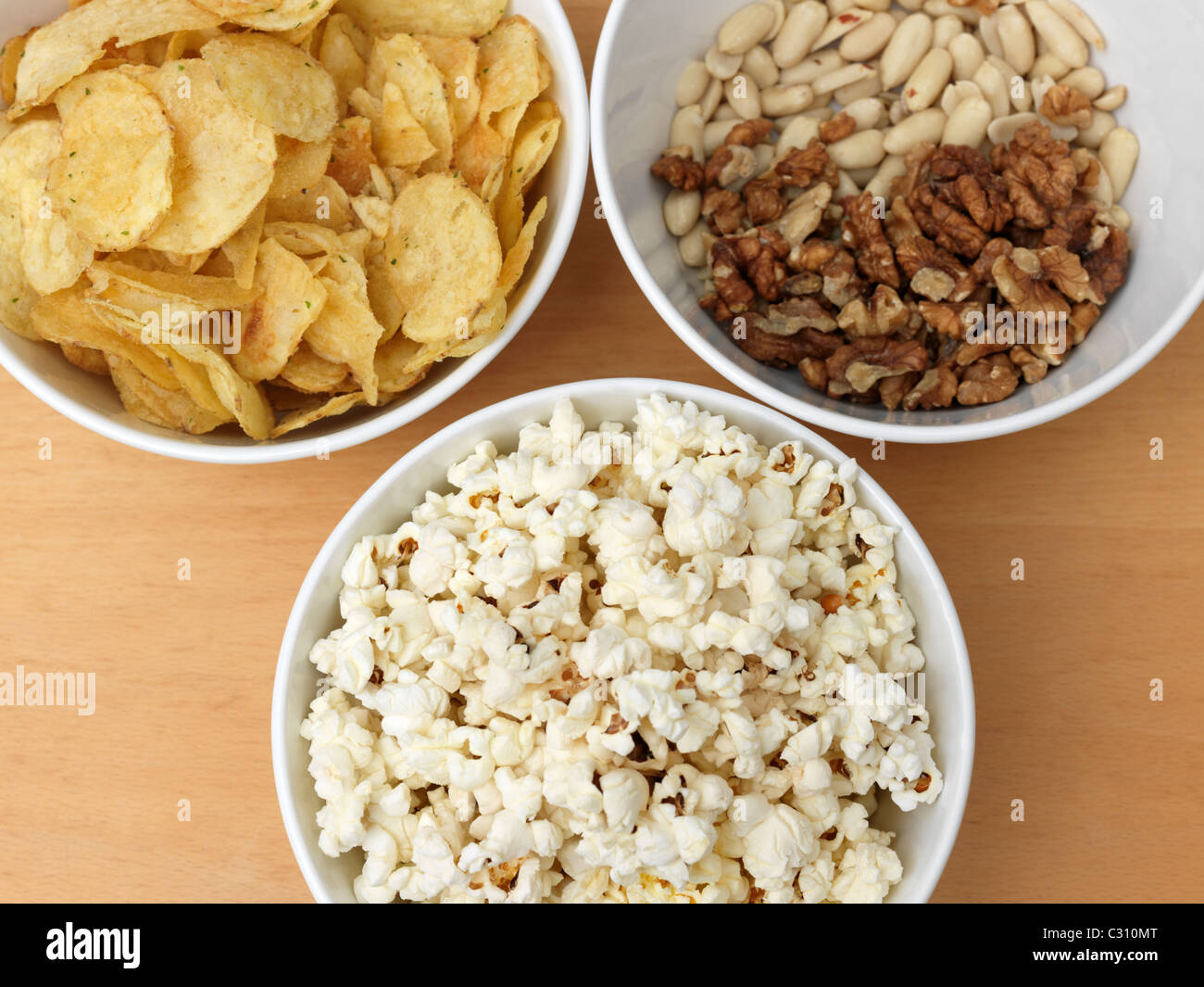 Bowls Of Crisps, Nuts And Popcorn Stock Photo - Alamy