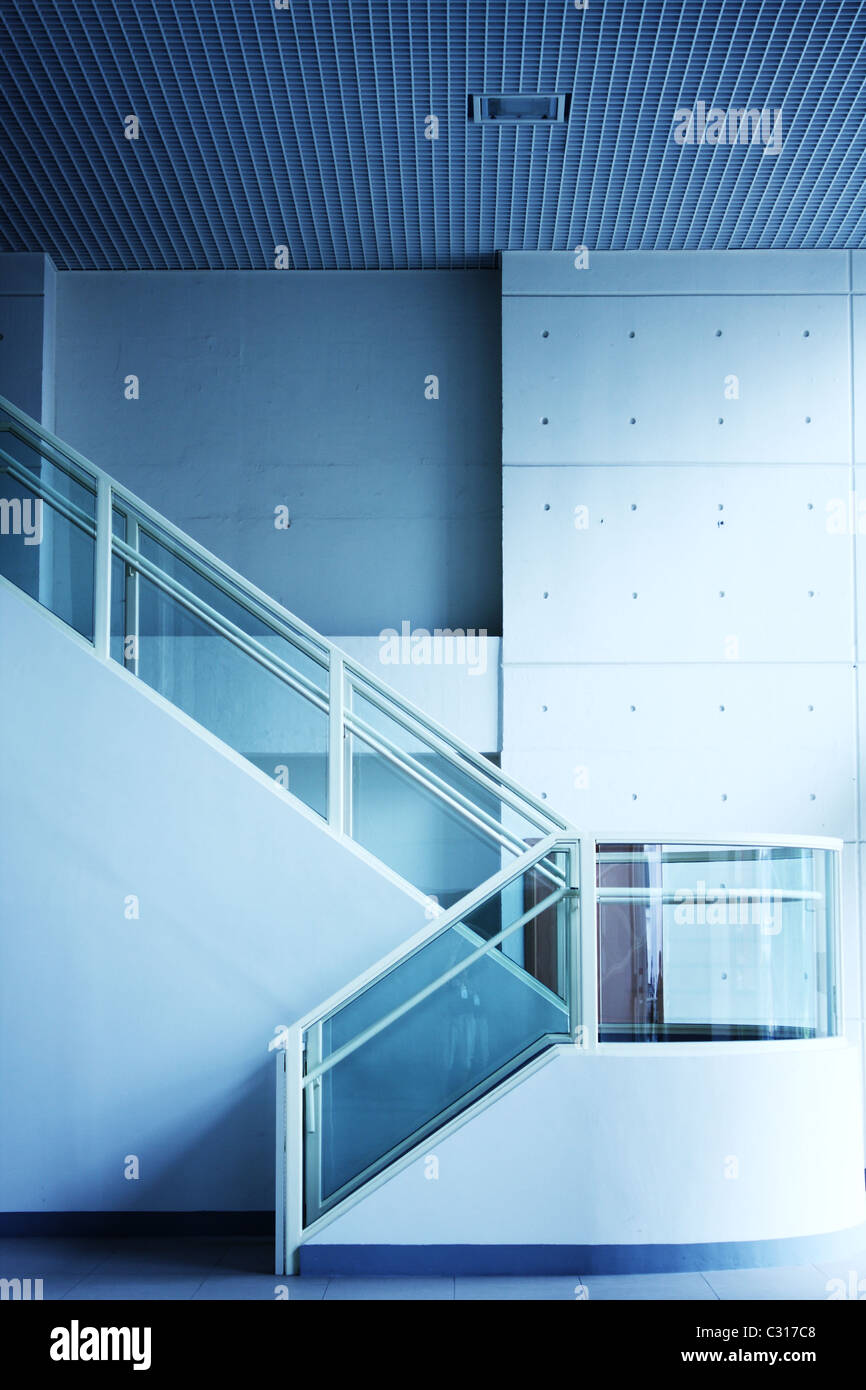 Modern interior of hall with stair with blue toned Stock Photo - Alamy