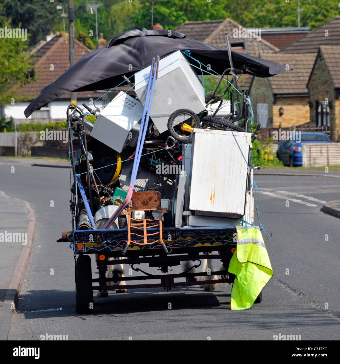 Rag and Bone man with horse & cart back view of load of junk white ...