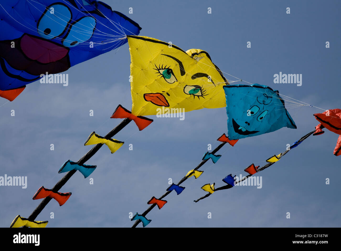 Four kites in a row at Streatham Park, family kite day Stock Photo - Alamy