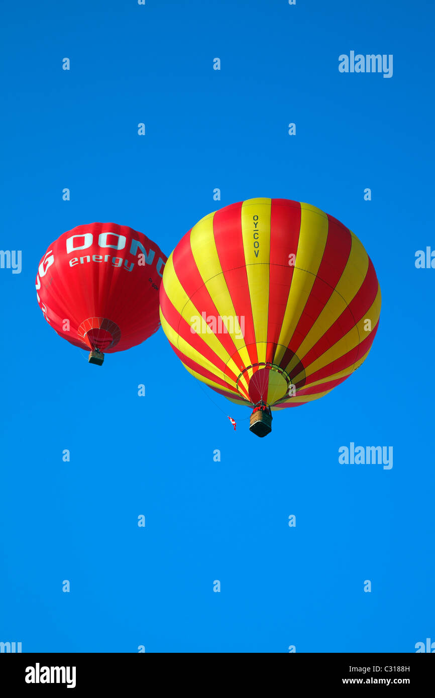 2 of 12 ascending hot air balloons in a commemorative flight on the ...