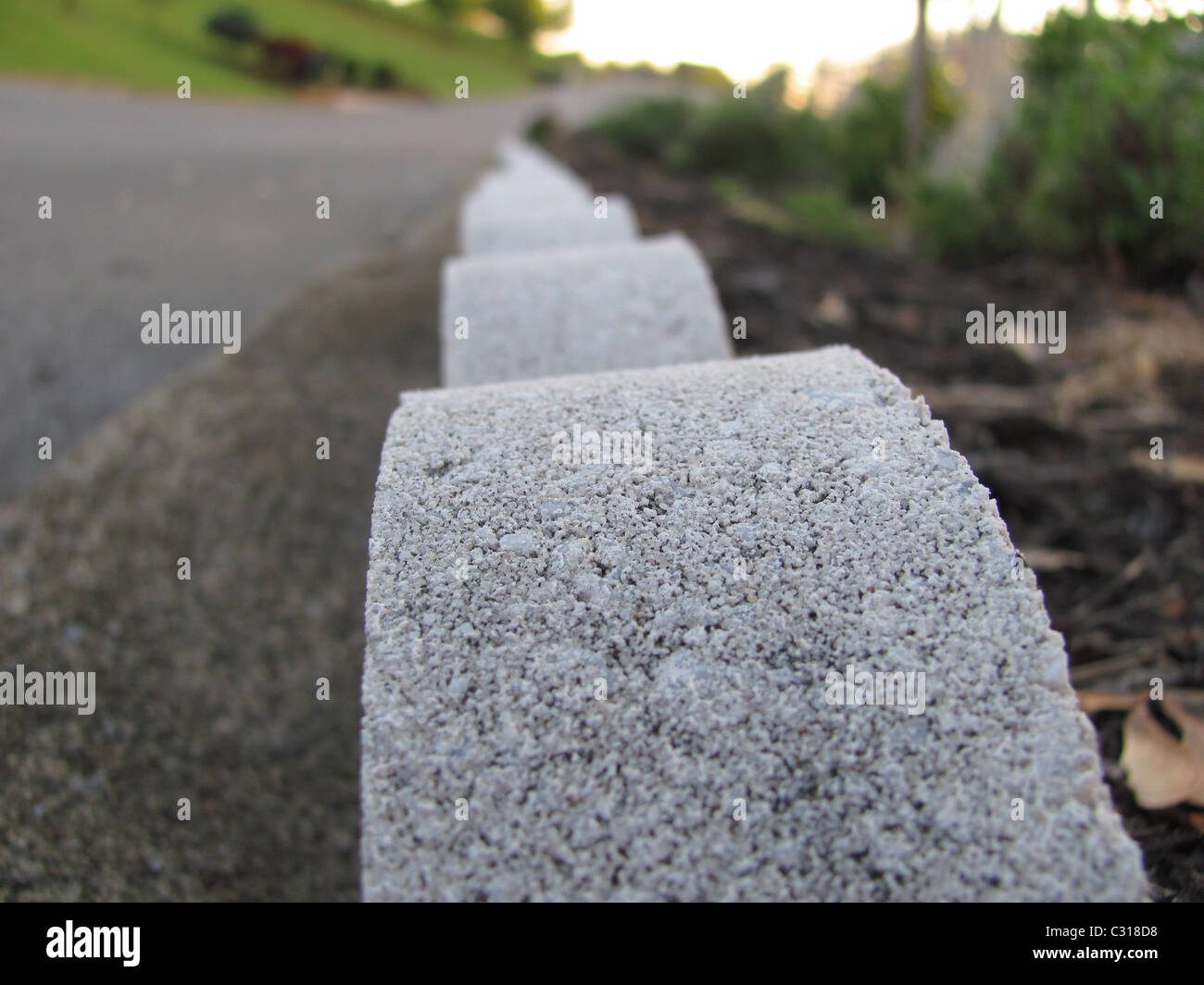 A small barrier separating garden from street Stock Photo - Alamy