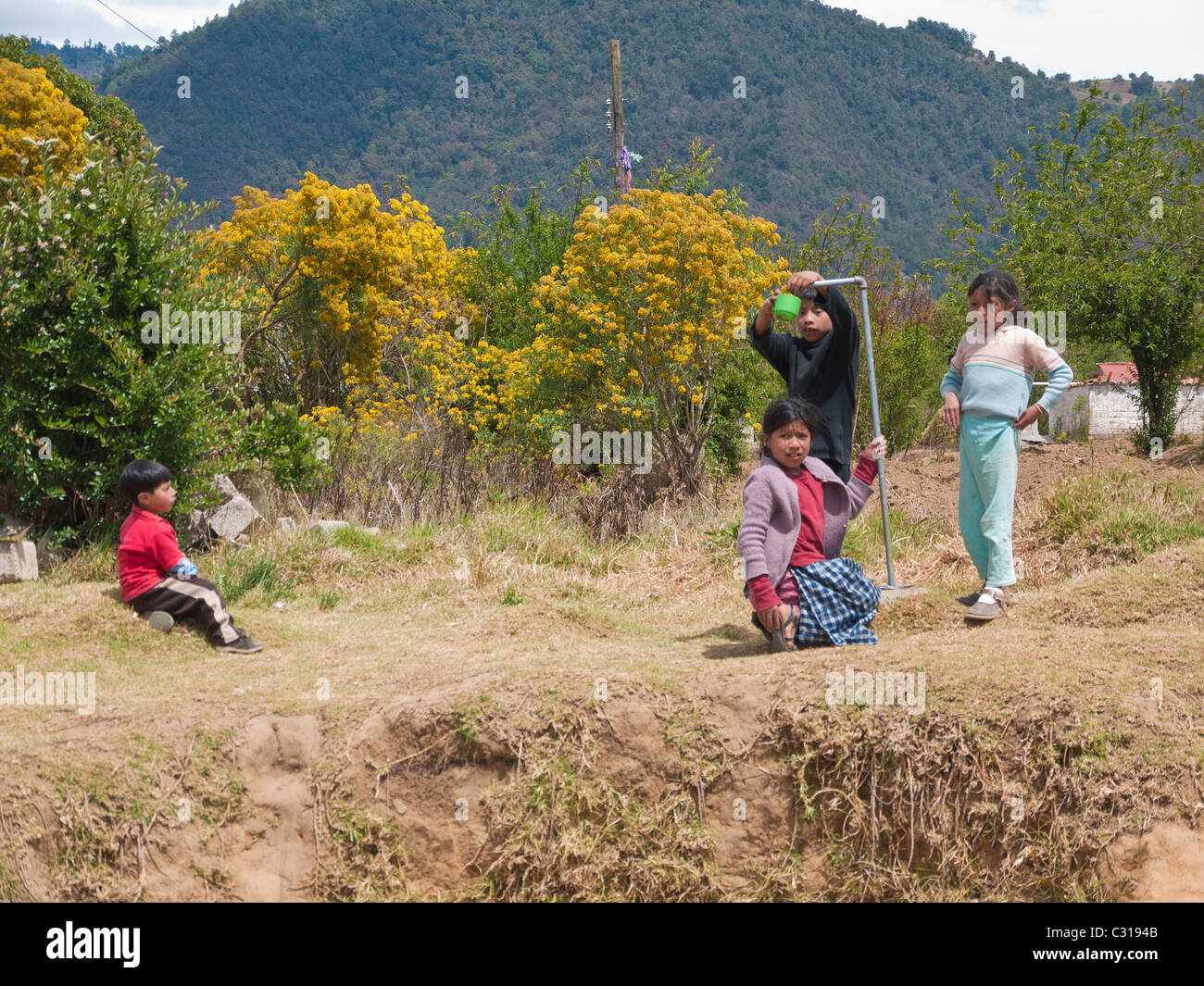 Four Guatemalan children play outside near their home in Totonicapan ...
