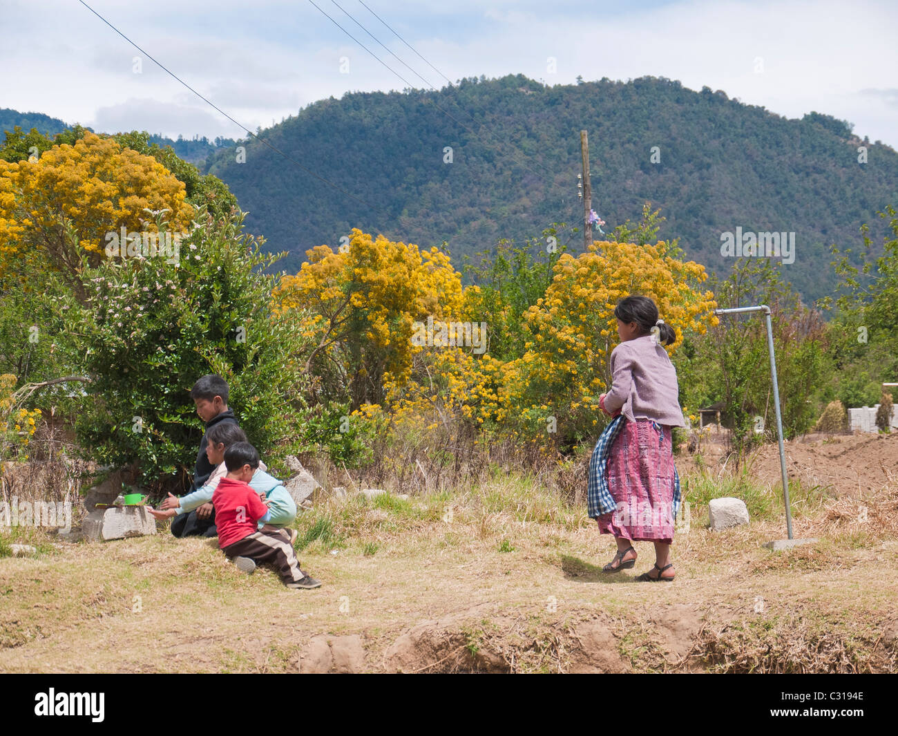 Four Guatemalan children play outside near their home in Totonicapan ...