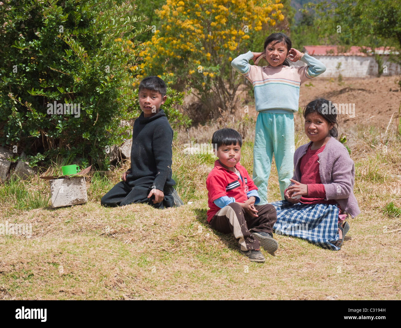 Four Guatemalan children play outside near their home in Totonicapan ...