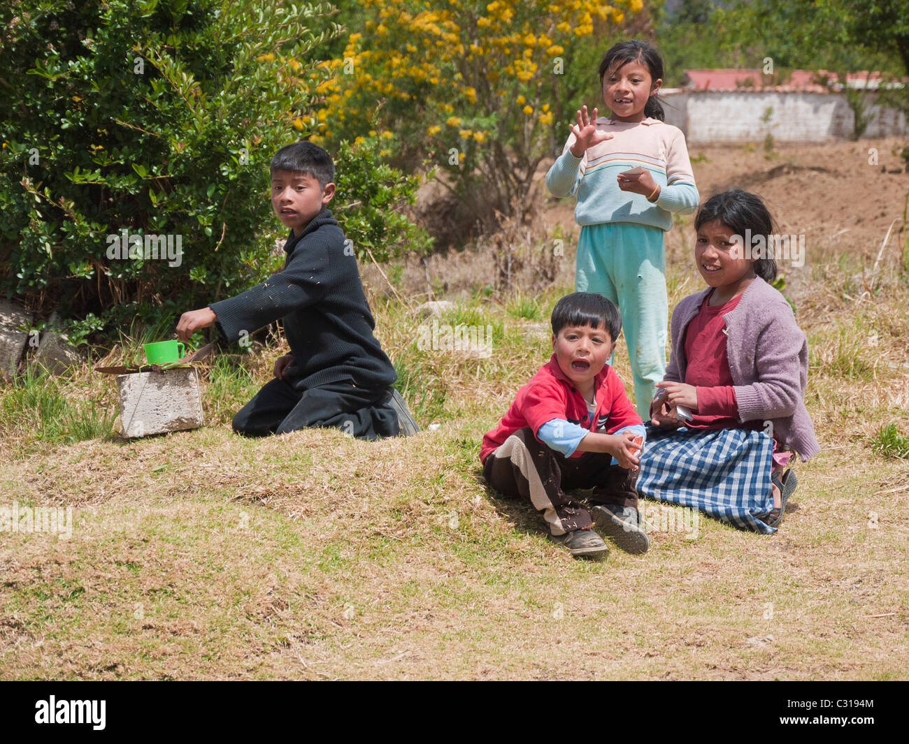 Four Guatemalan children play outside near their home in Totonicapan ...
