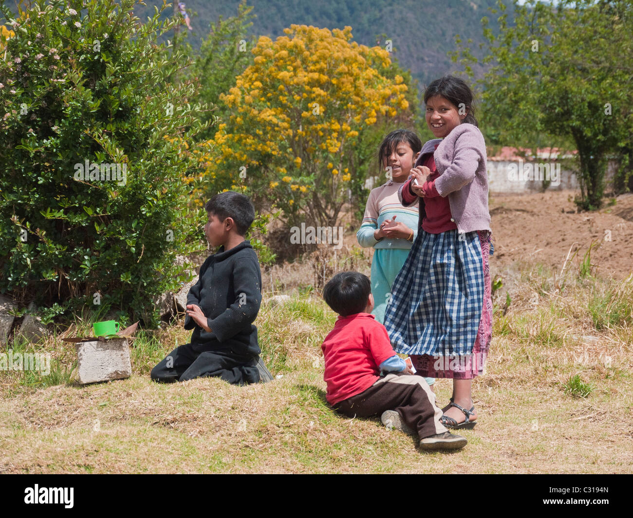 Four Guatemalan children play outside near their home in Totonicapan ...