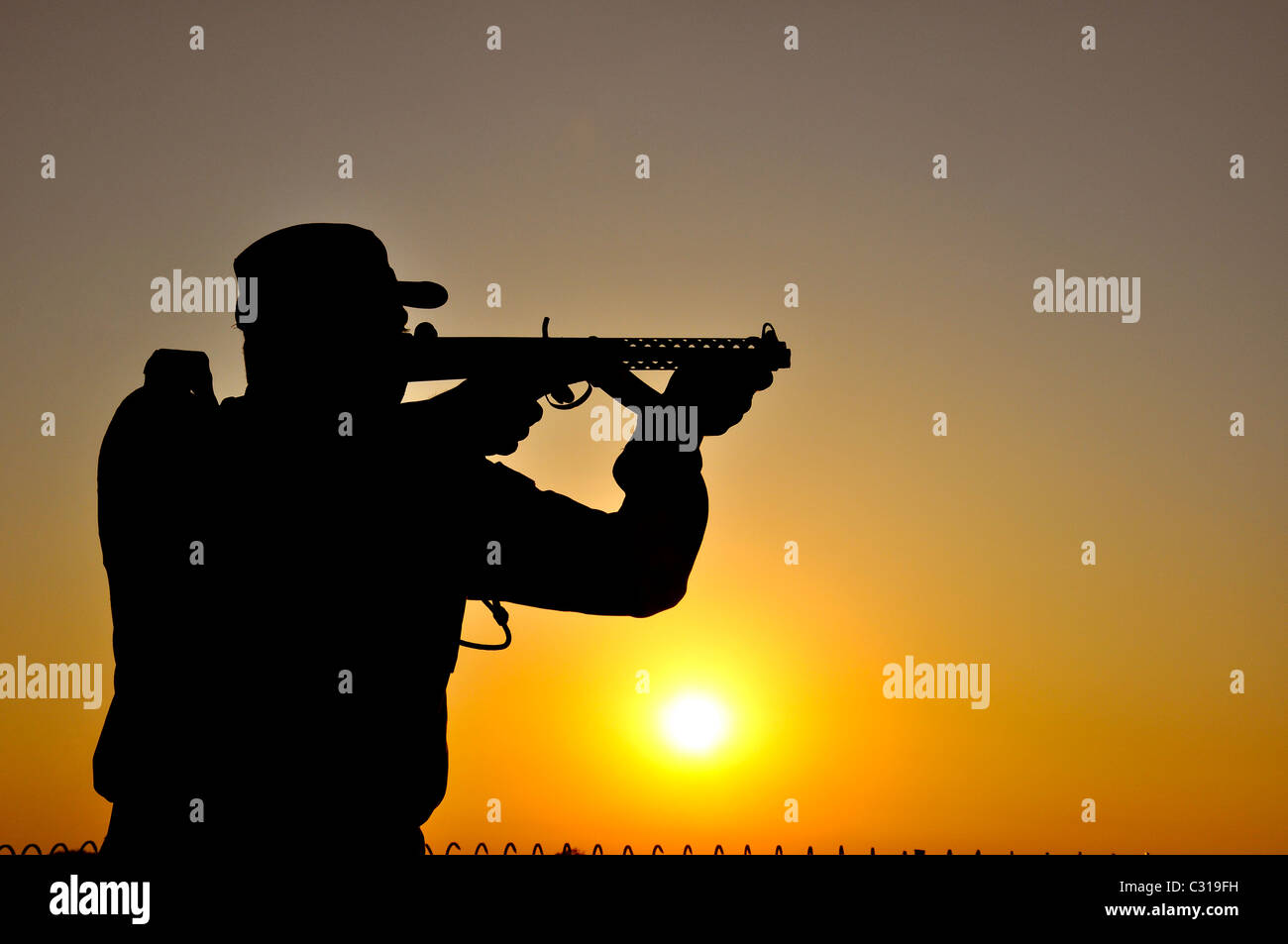 An Indian security personnel aiming carbine gun Stock Photo - Alamy
