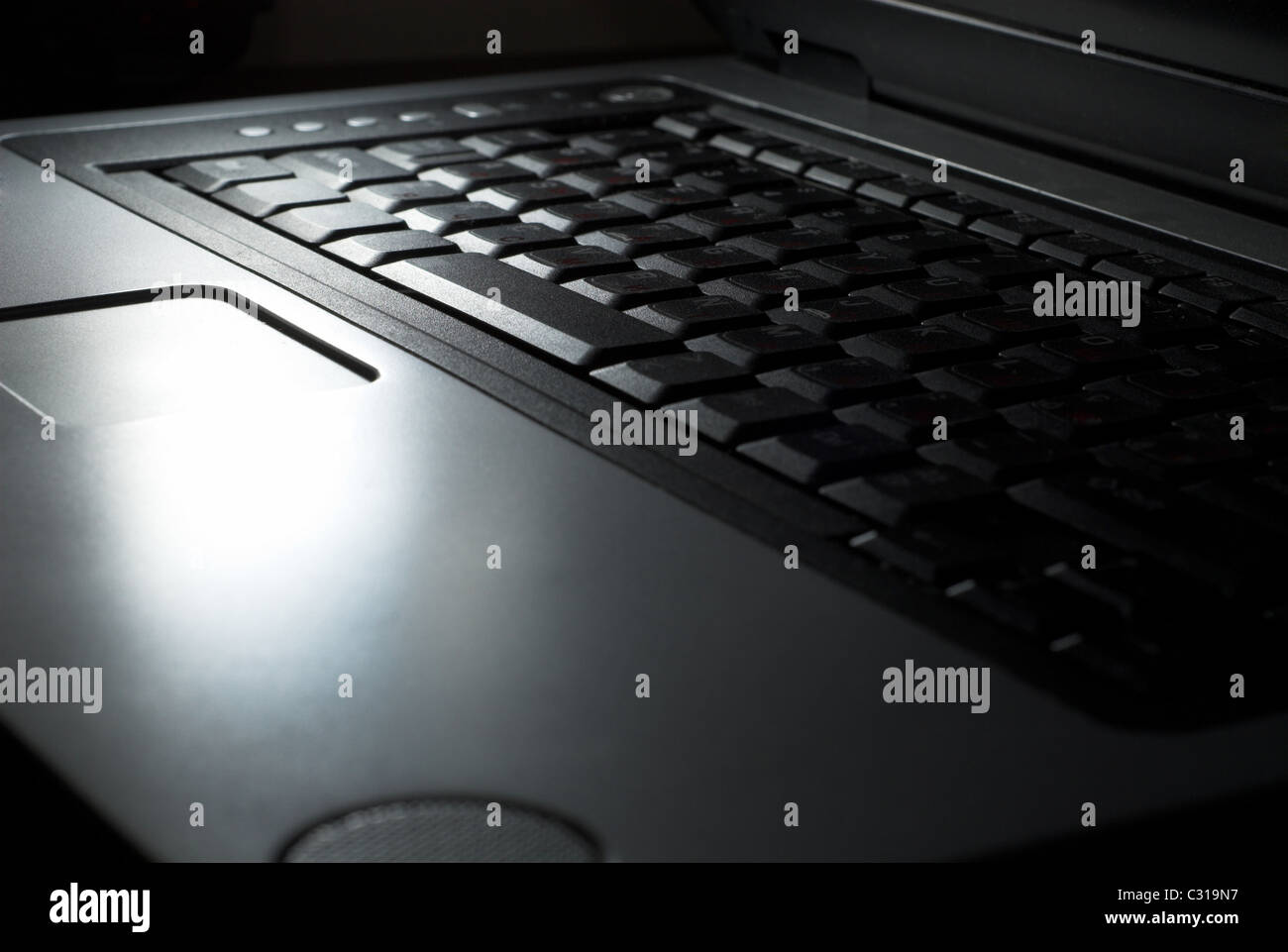 Laptop keyboard in cold colors. Flash is opposite to the camera Stock ...