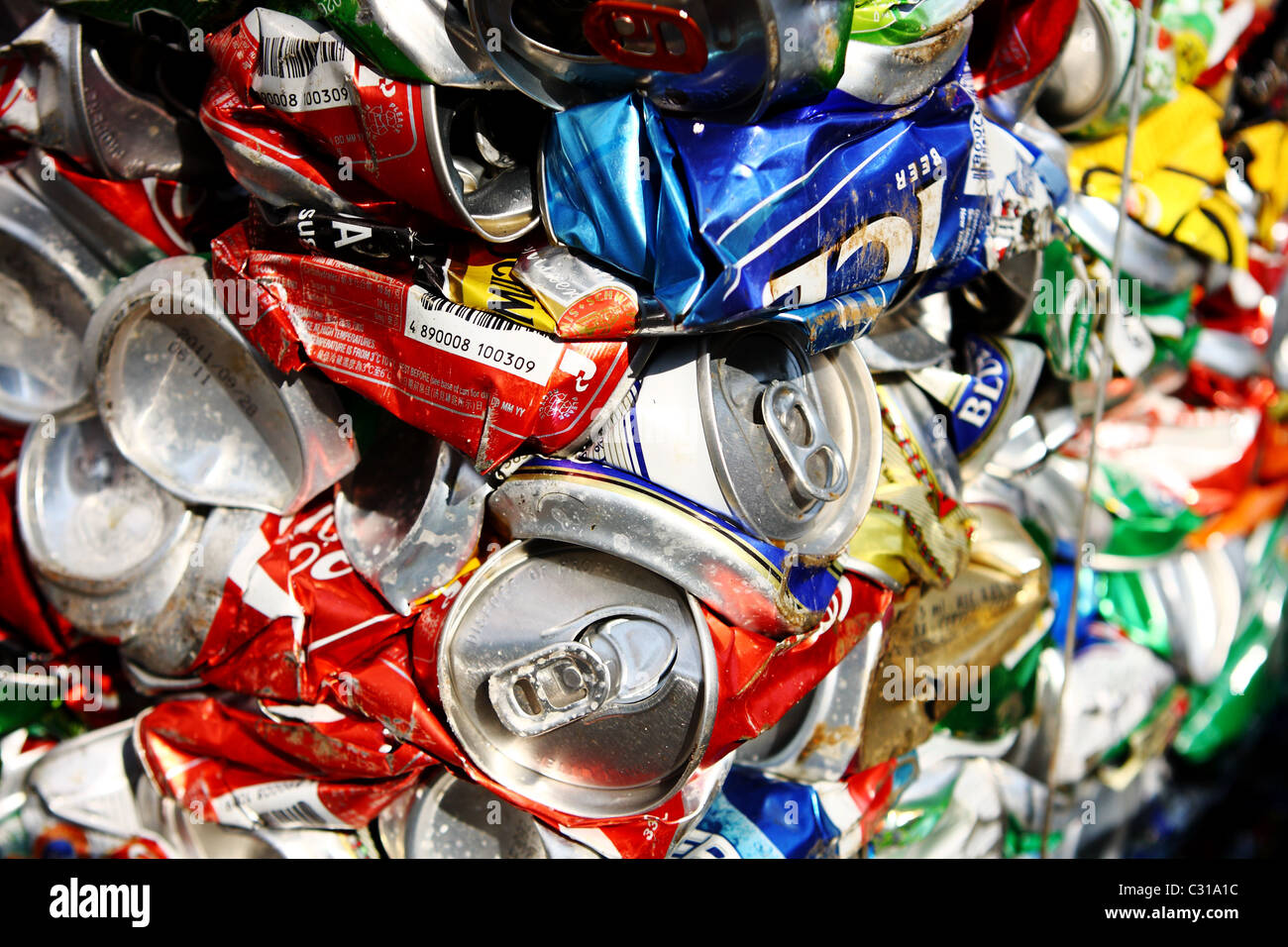 Compressed beer can background close up Stock Photo - Alamy