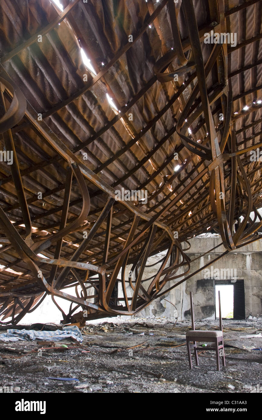 Discarded building, metal roof fall down Stock Photo - Alamy