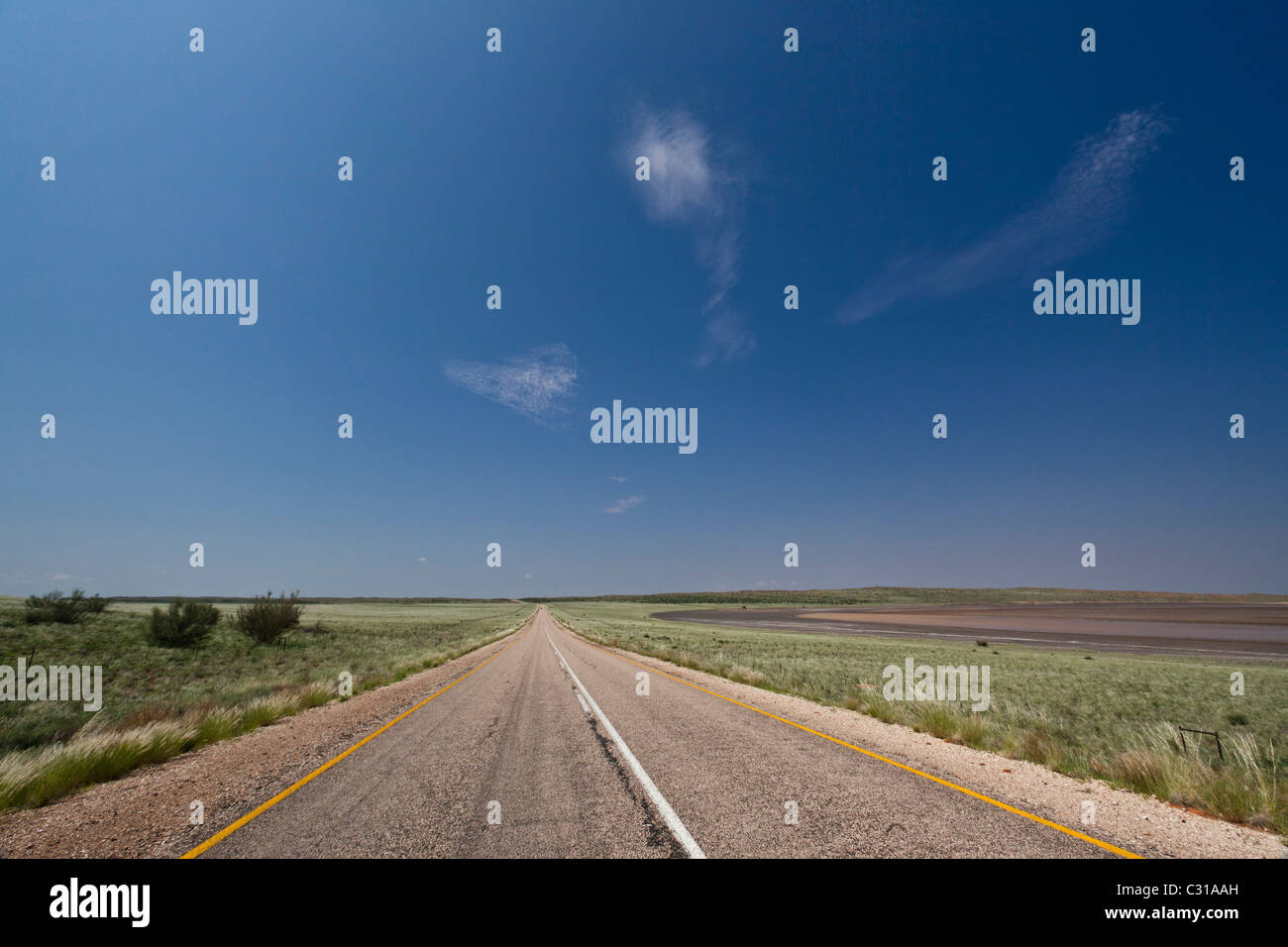 A Salt pan beside the long straight road near Brandvlei, Northern Cape ...