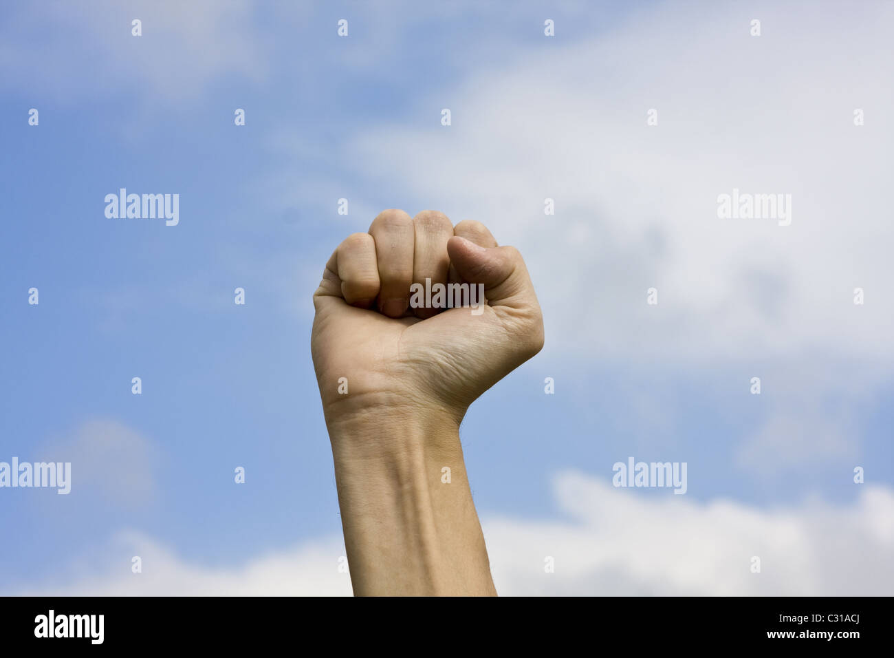 Hand with the Sky Background to show challenge to a fight or contest ...