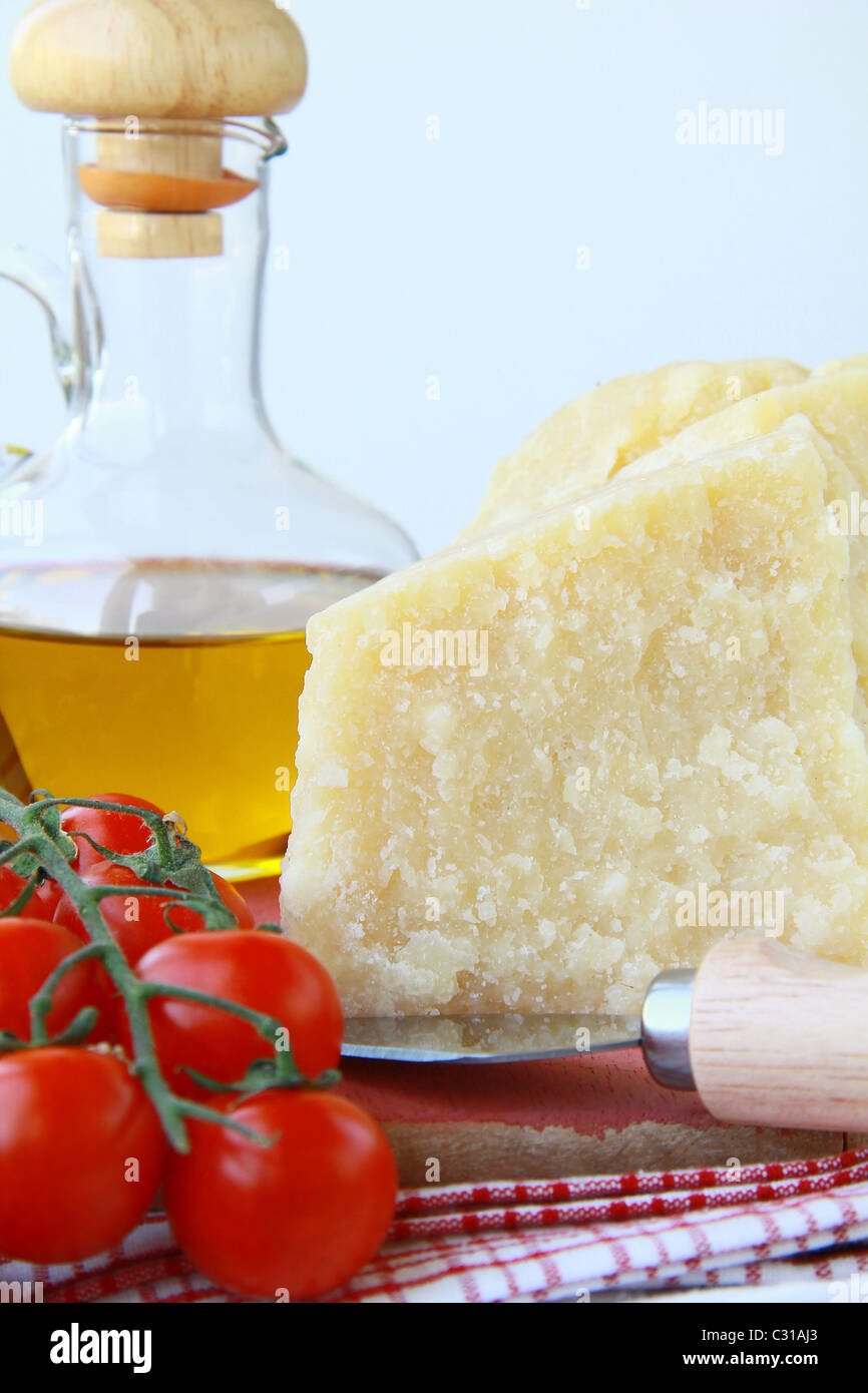 parmesan cheese on a wooden table with knife Stock Photo - Alamy
