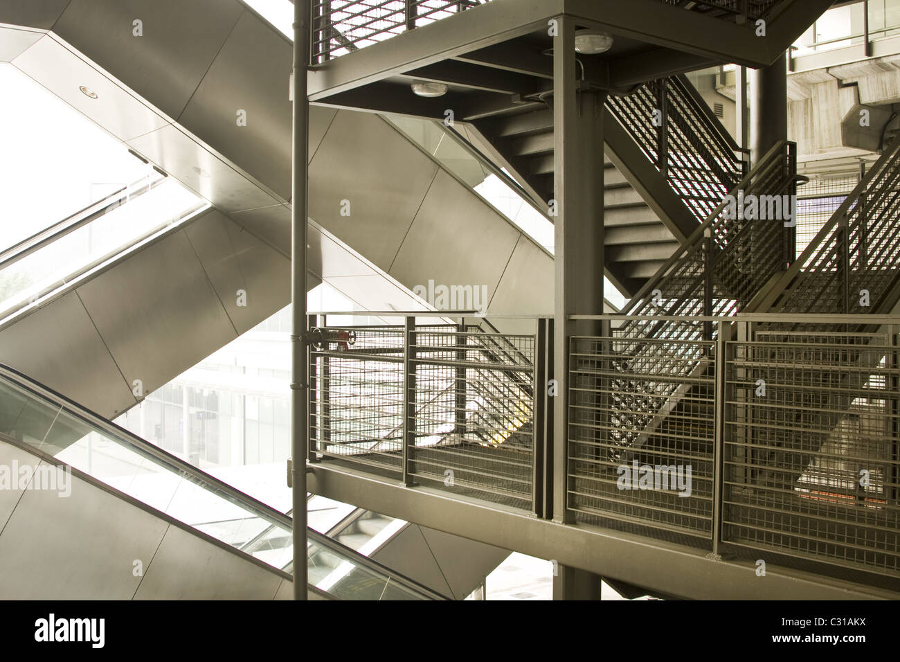 it is a modern escalator and a tradition stairs, made a composition ...