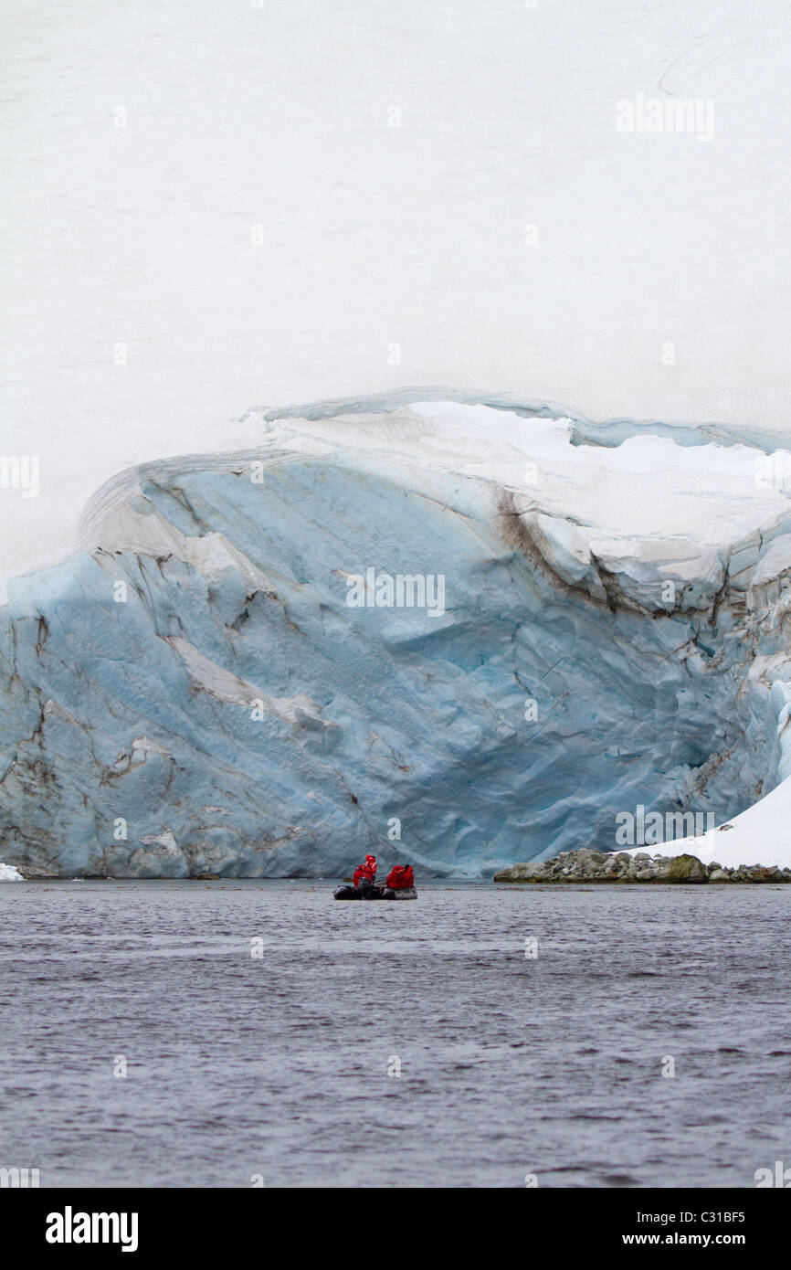 Zodiac with passengers in front of Larsen Harbour, South Georgia Island ...