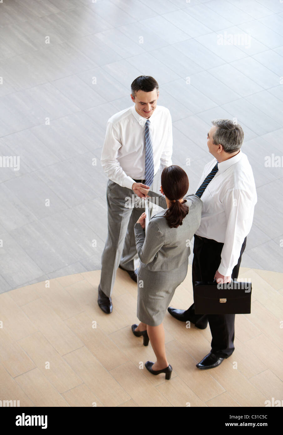 Image of business partners handshaking after signing contract Stock ...
