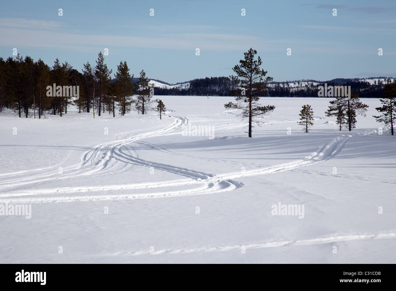 Snowmobile tracks across a frozen lake near Arvidsjaur, Northern Sweden ...