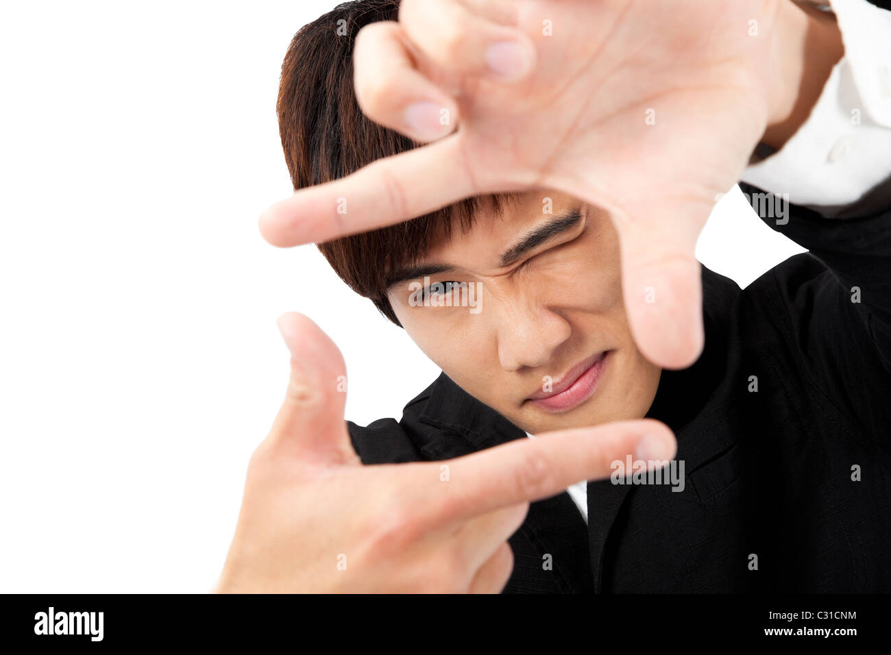Closeup of young man making frame with hands Stock Photo - Alamy