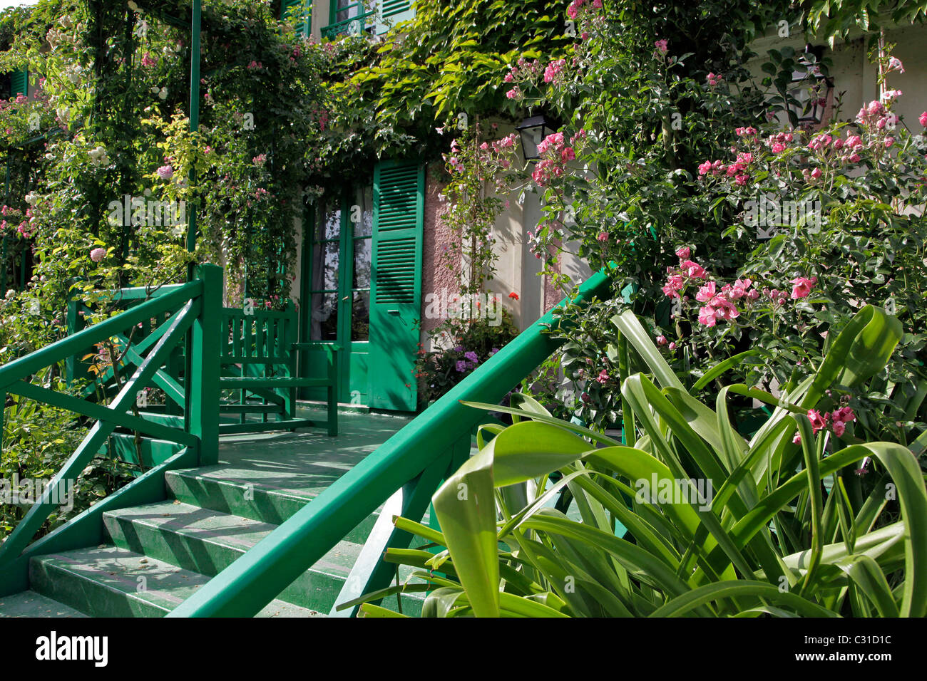 FACADE OF THE IMPRESSIONIST PAINTER CLAUDE MONET'S HOUSE AND HIS GARDEN ...