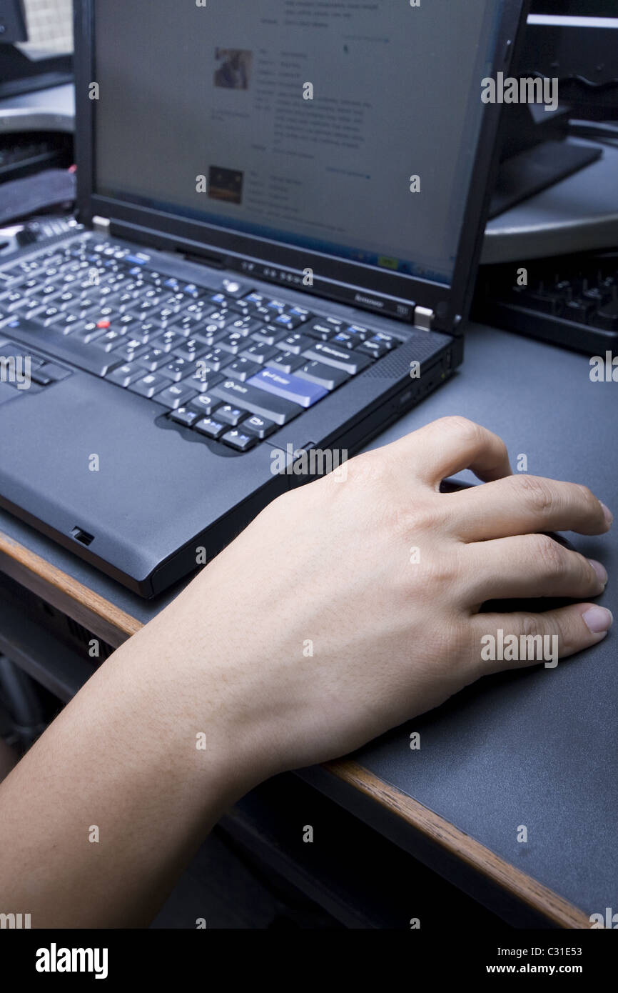 Close up of woman's hands using keyboard and mouse Stock Photo - Alamy