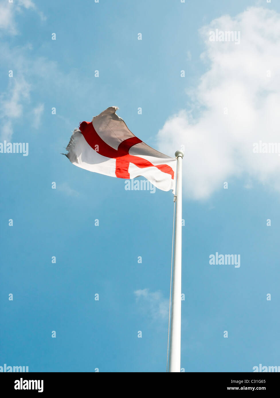St George's Flag flying against a bright blue sky Stock Photo - Alamy