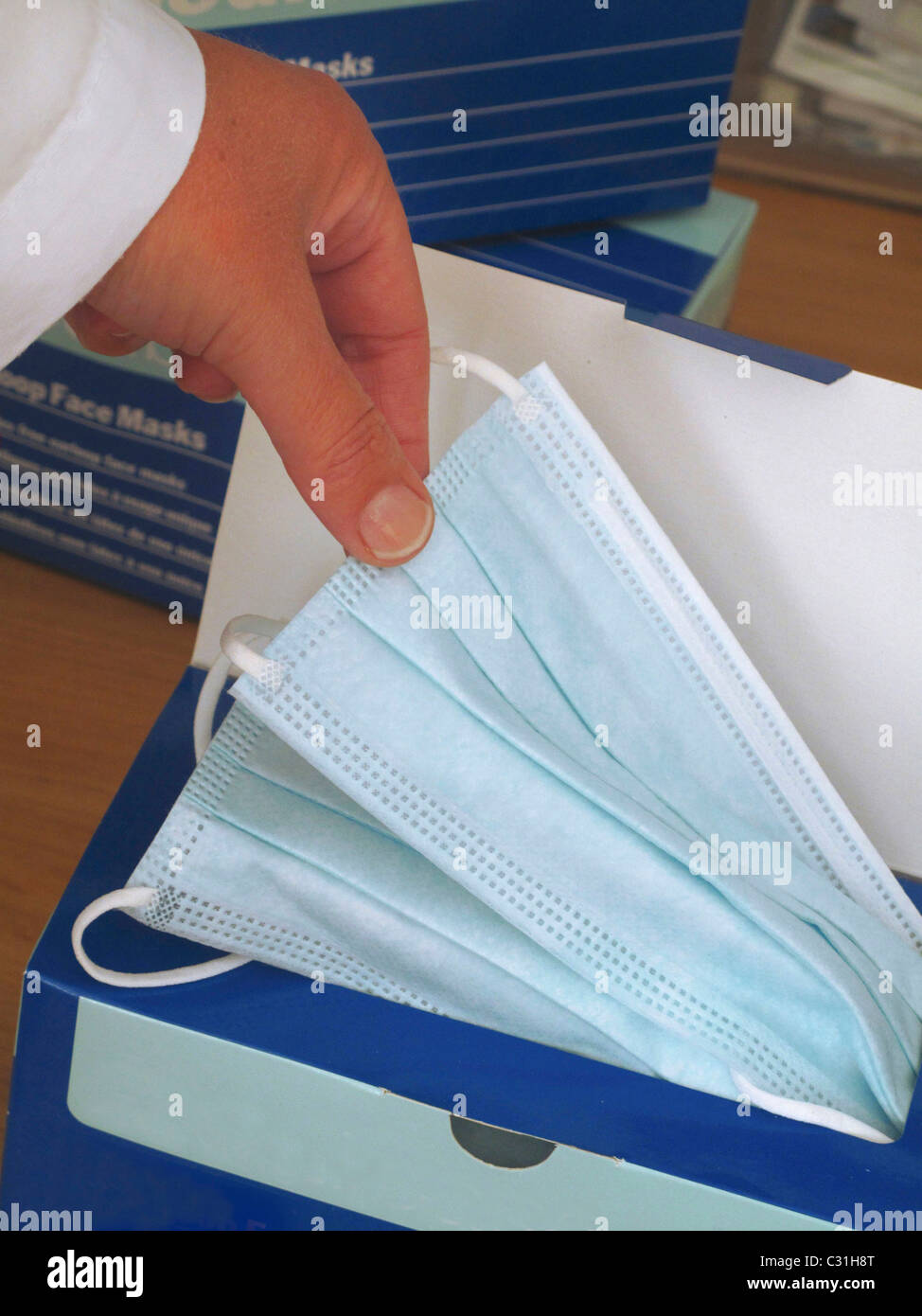 MEDICAL PERSONNEL TAKING A SURGICAL MASK, PREVENTION AND FIGHT AGAINST ...