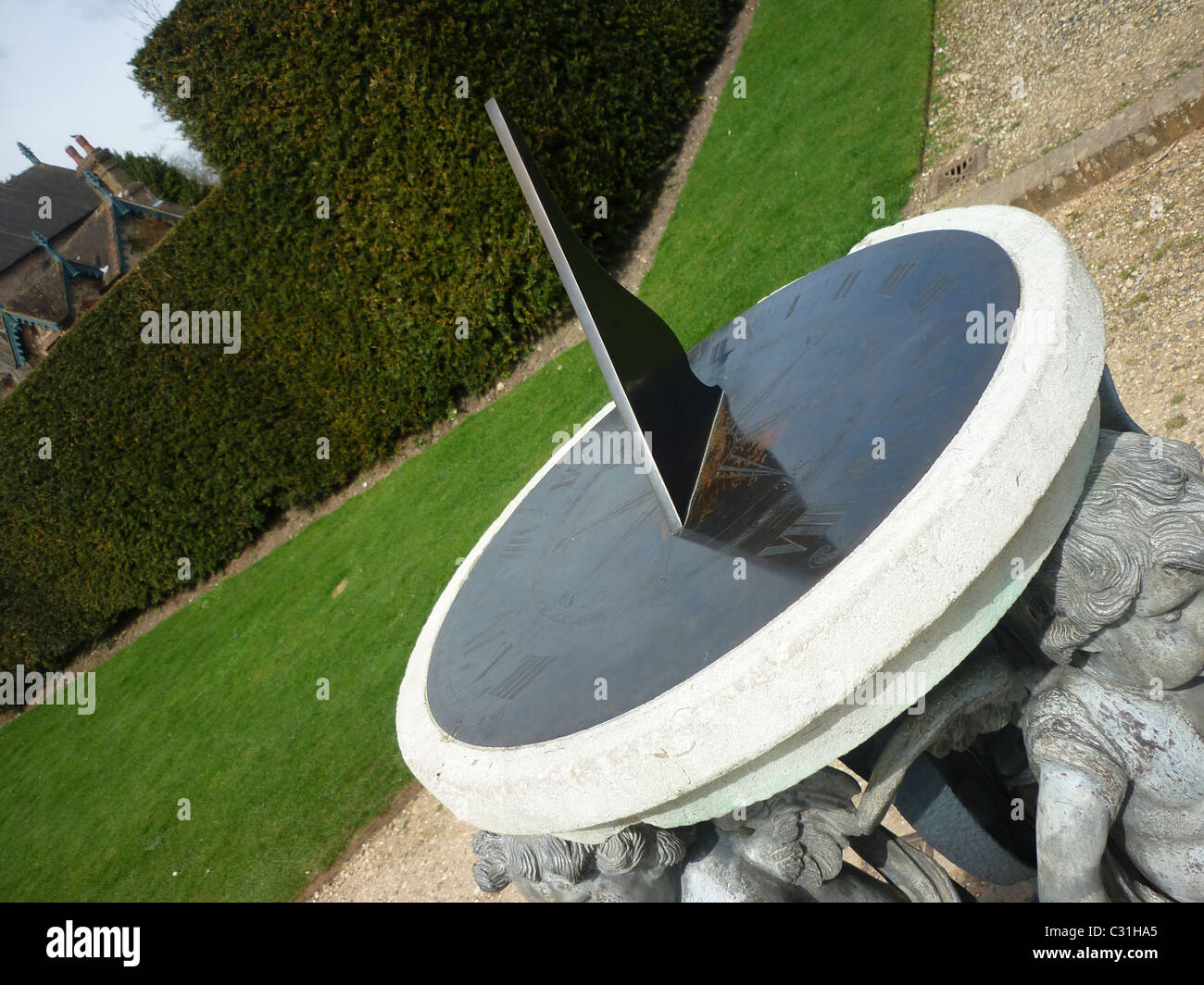 Sundial in public garden Stock Photo - Alamy