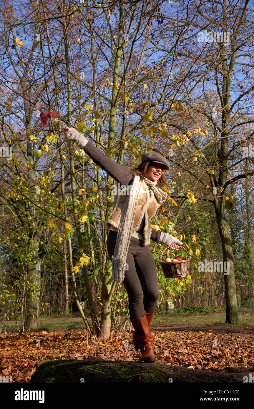 Young girl balancing tree trunk hi-res stock photography and images - Alamy