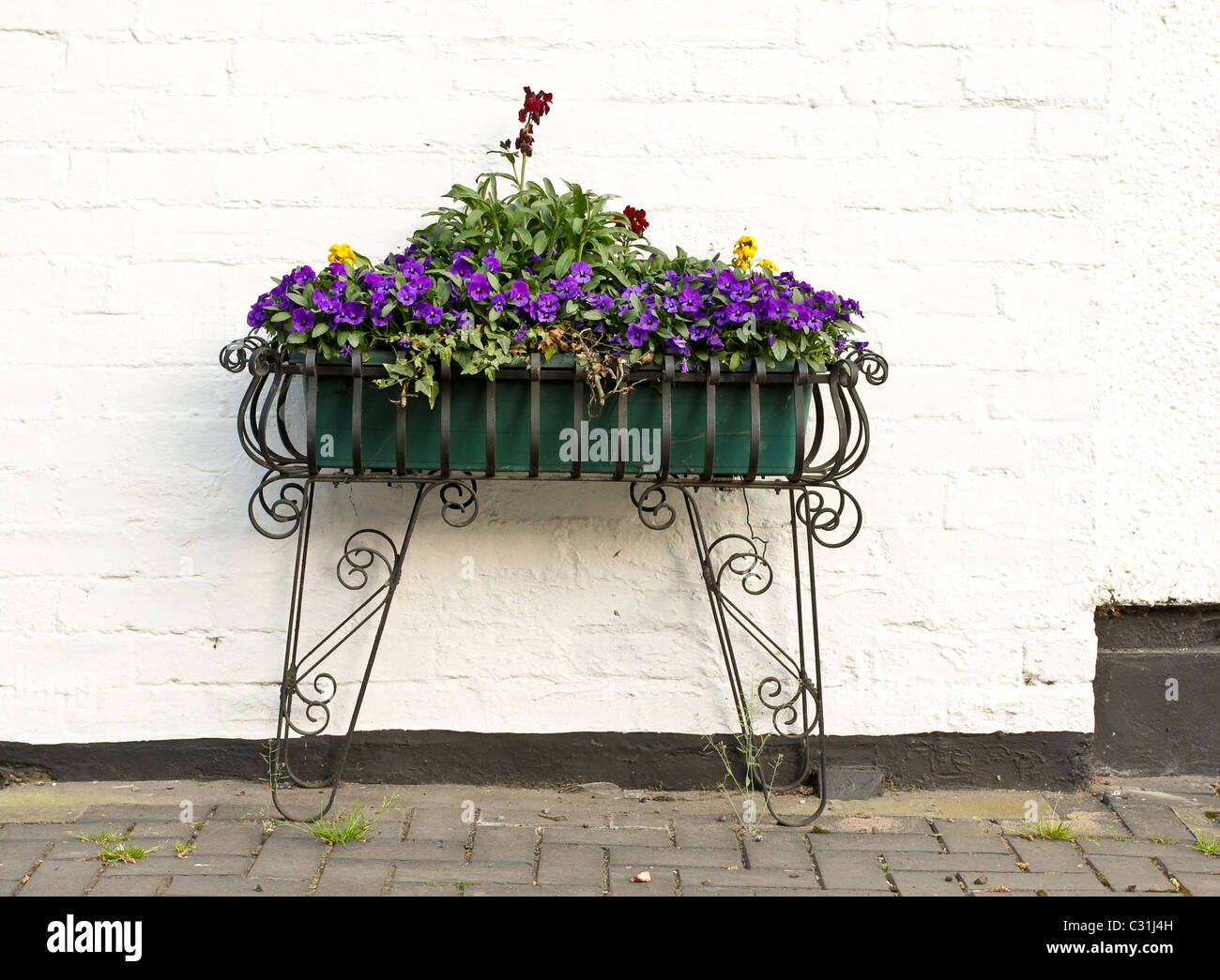 Attractive outside antique flower display Stock Photo - Alamy