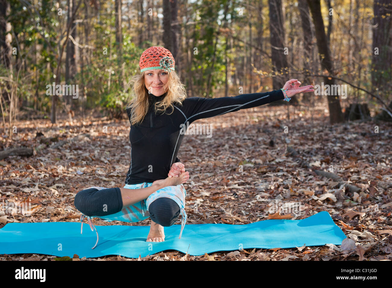 A woman doing yoga postures in outdoor setting Stock Photo - Alamy