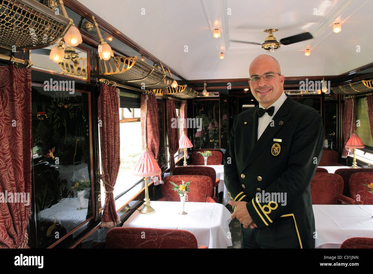 Posing in the dining car of the prestigious orient express hi-res stock ...
