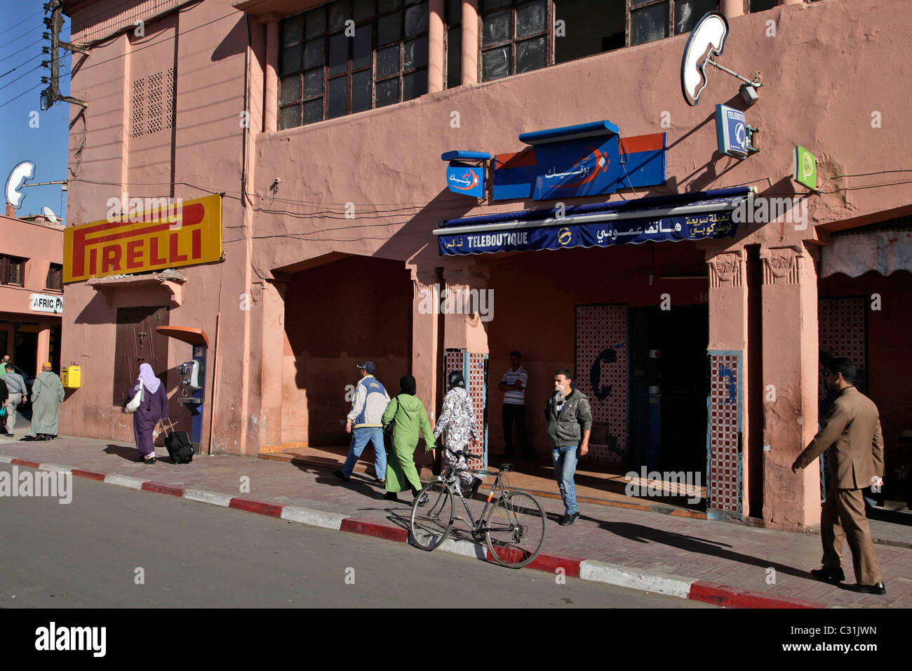 THE STORE PIRELLI AND A TELEBOUTIQUE (PUBLIC TELEPHONE), STREET SCENE ...