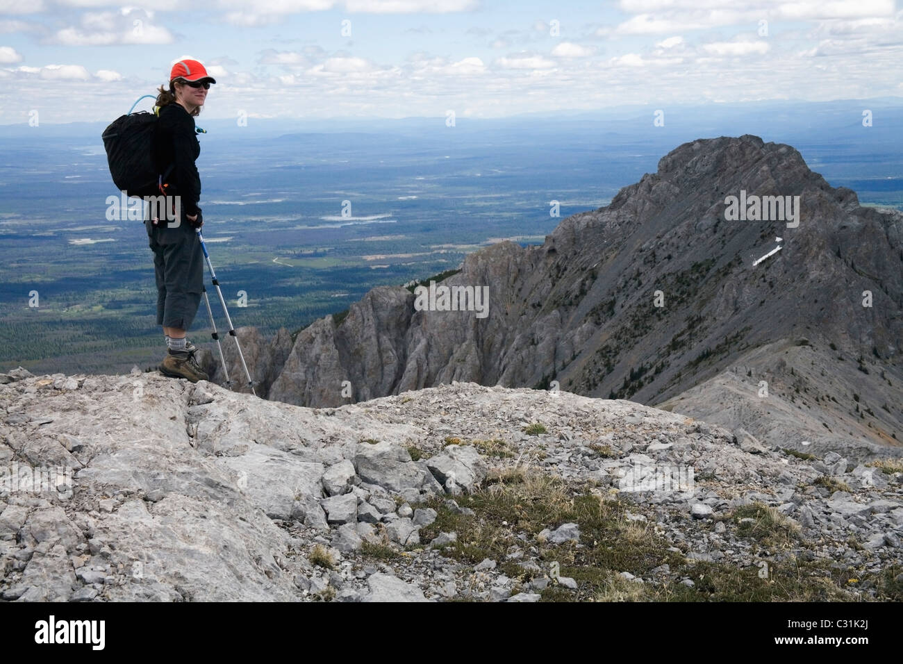 A female hiker admires the view in the southern Chilcotin mountains ...