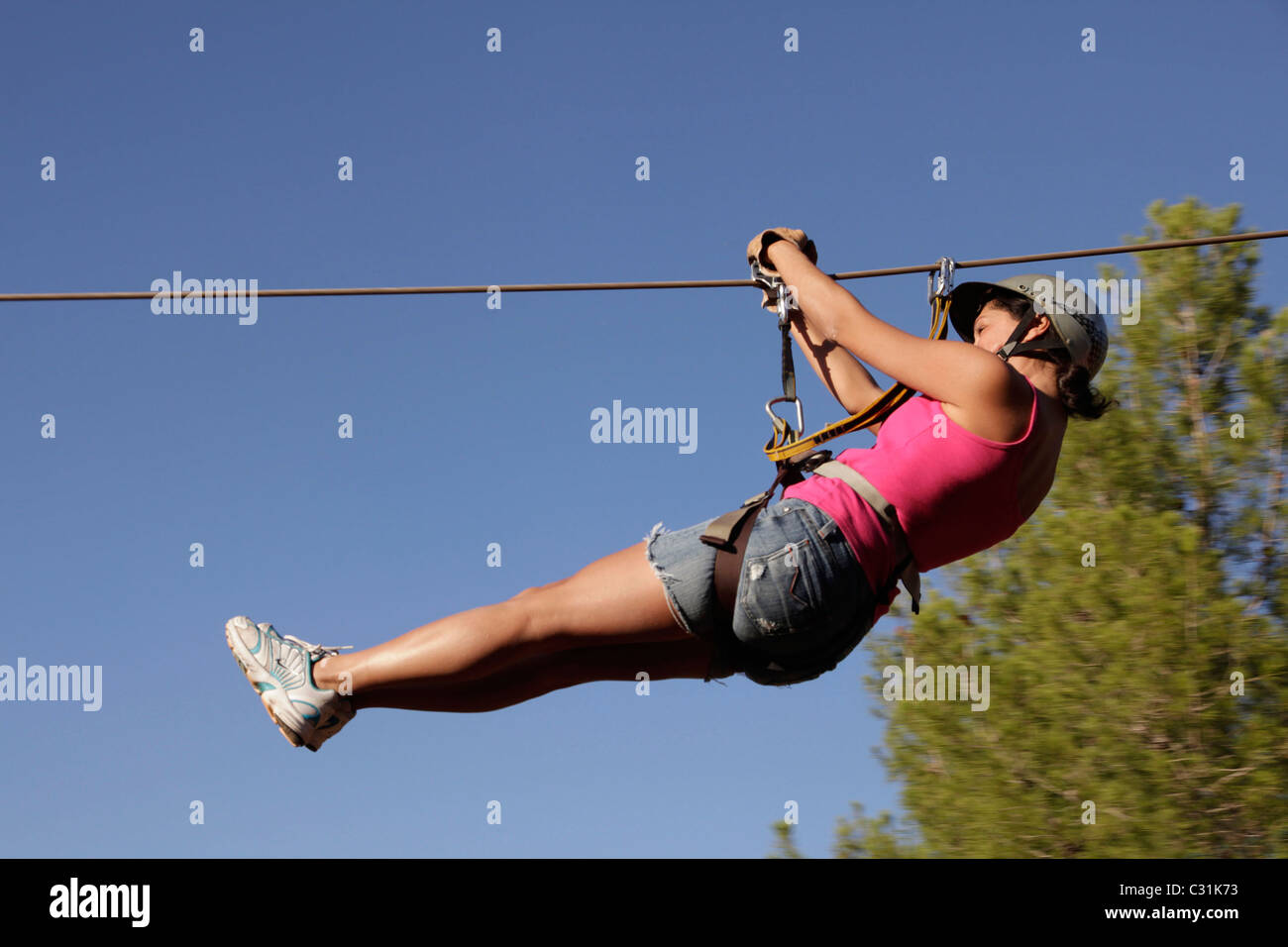 Tyrolean crossing hanging between the red earth cliffs hi-res stock ...