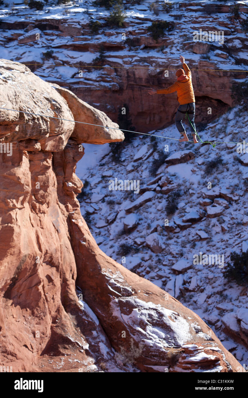A man walks across a highline, Moab, Utah Stock Photo - Alamy